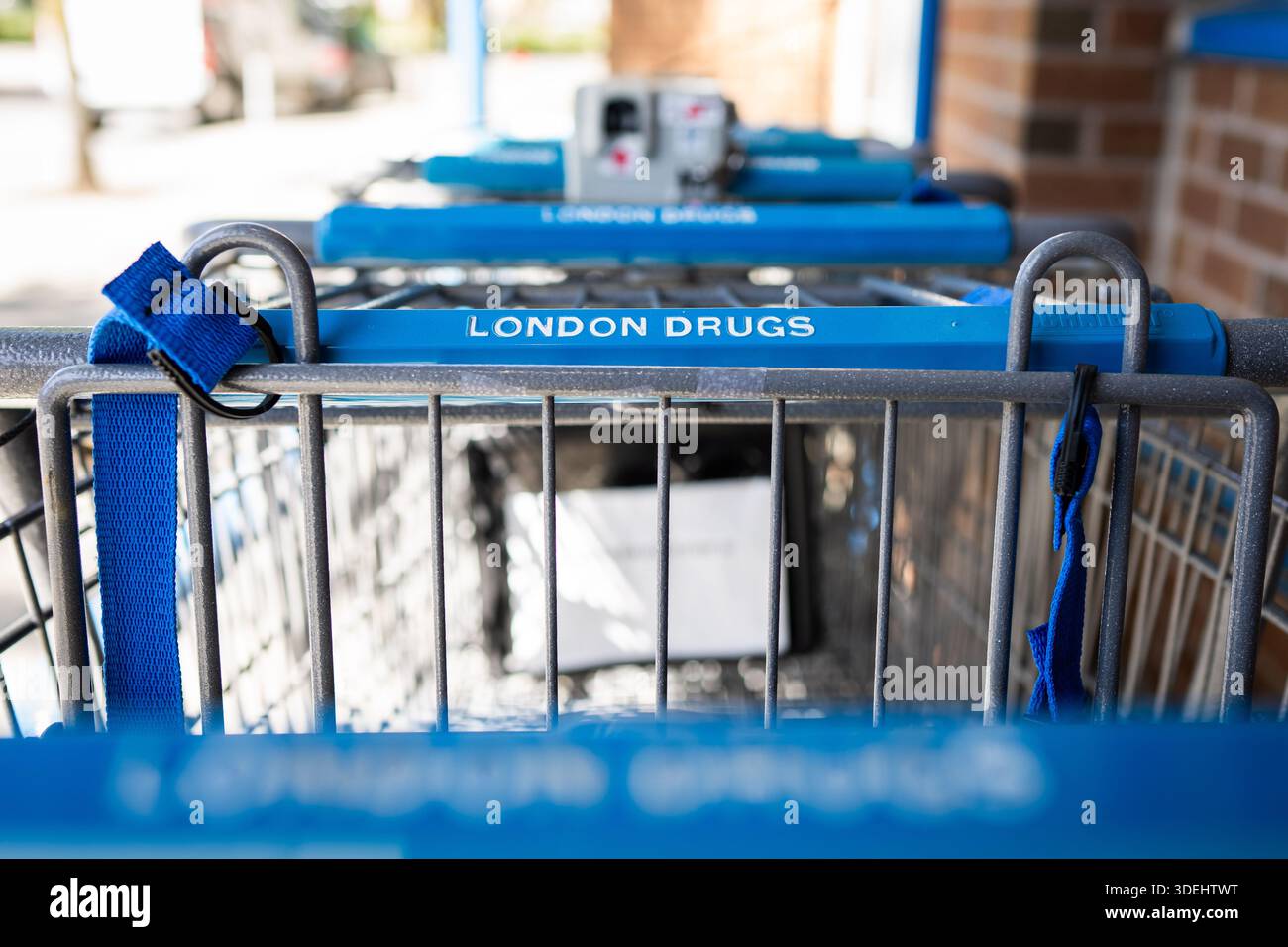 Shopping carts are seen outside of the London Drugs Kerrisdale location ...