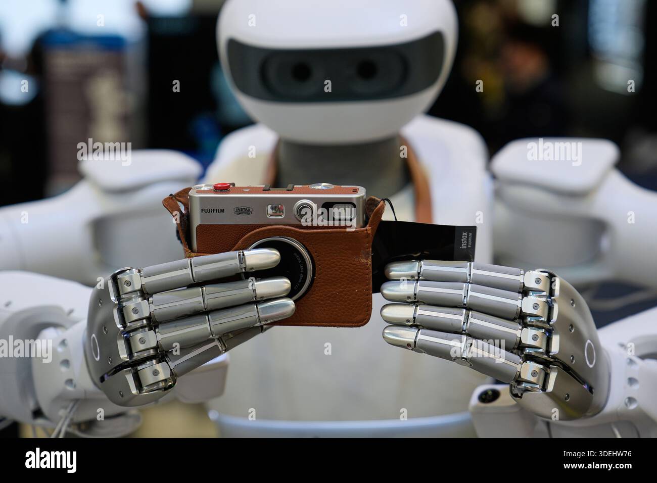 The Sharpa North robot uses a camera at the Sharpa booth during the CES ...