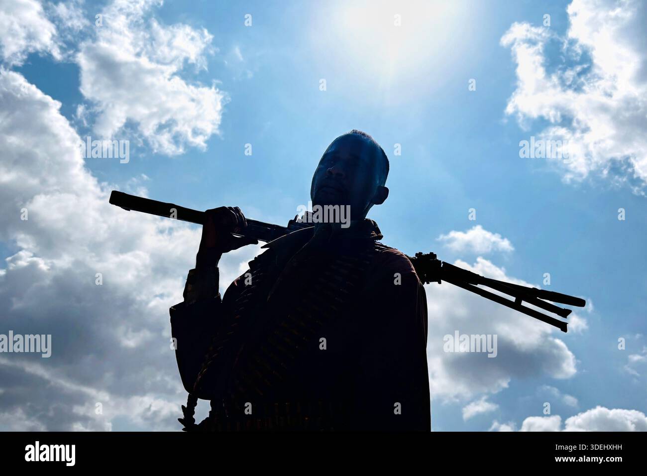 A Somali National Army (SNA) soldier carries a weapon on the frontline ...
