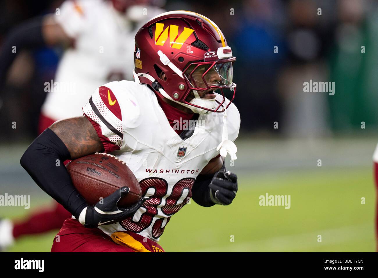 Washington Commanders safety Jeremy Reaves returns the interception ...