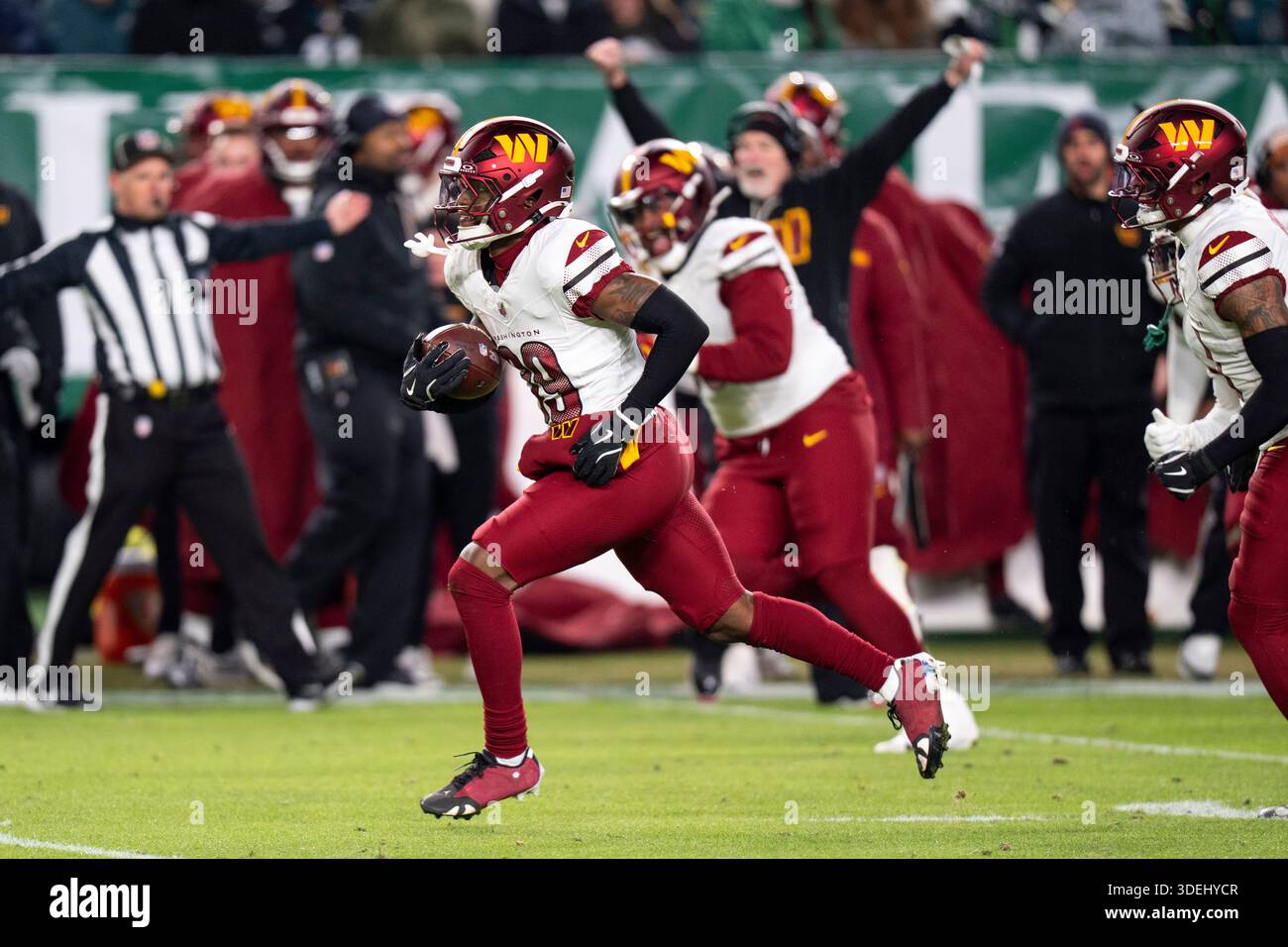 Washington Commanders safety Jeremy Reaves celebrates the interception ...