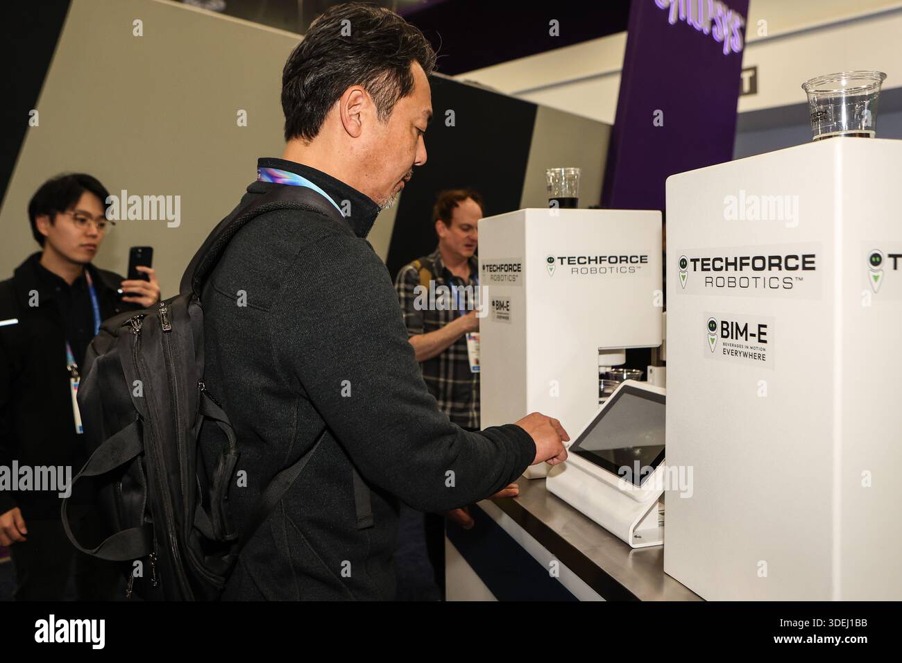 January 7, 2026: An attendee uses the TechForce Robotics beverage ...