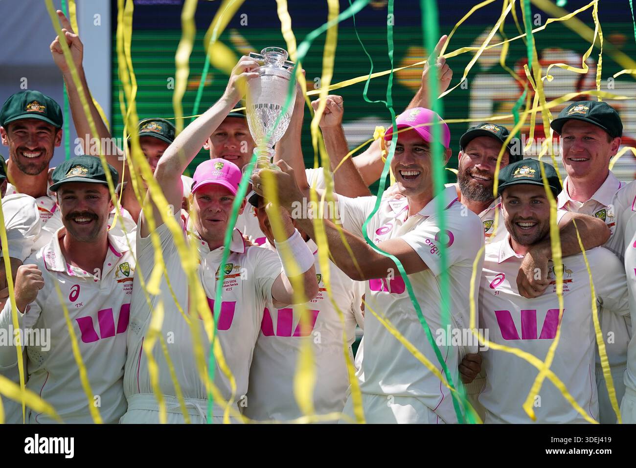 Australia's Steve Smith (centre) and Pat Cummins (right) lift the Ashes ...