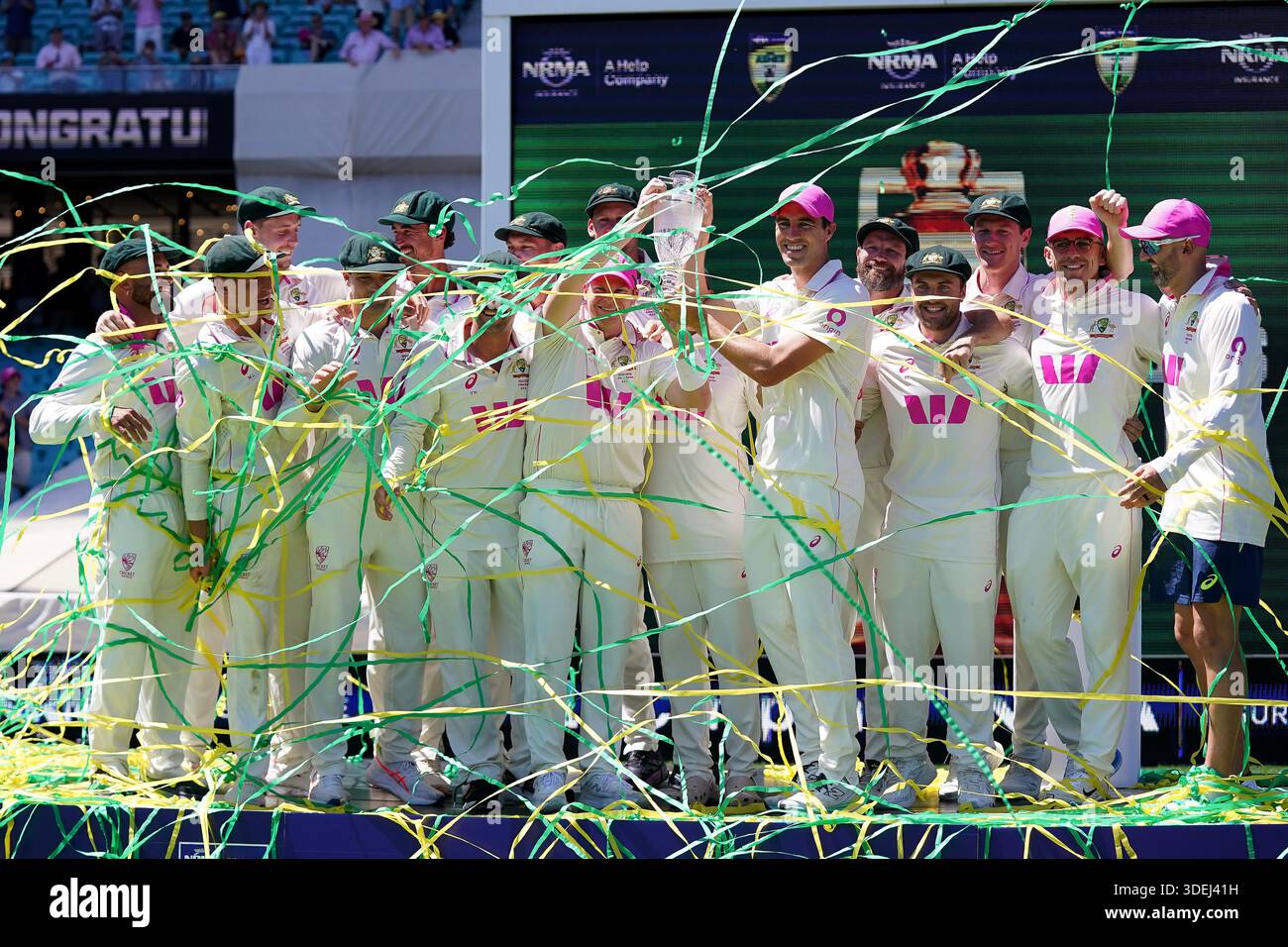 Australia's Steve Smith (centre) and Pat Cummins (right) lift the Ashes ...