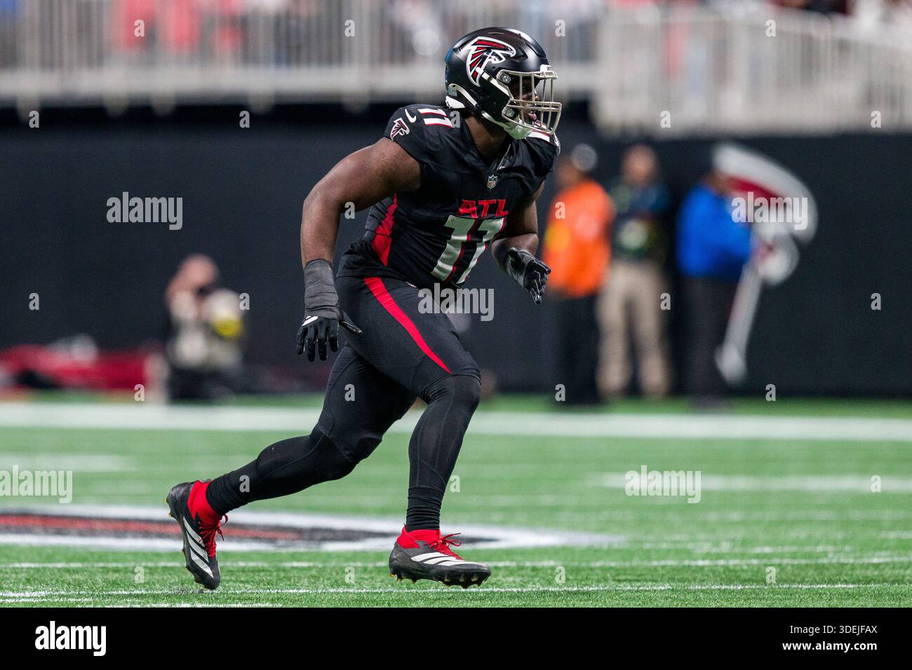 Atlanta Falcons linebacker Jalon Walker (11) works during the first ...