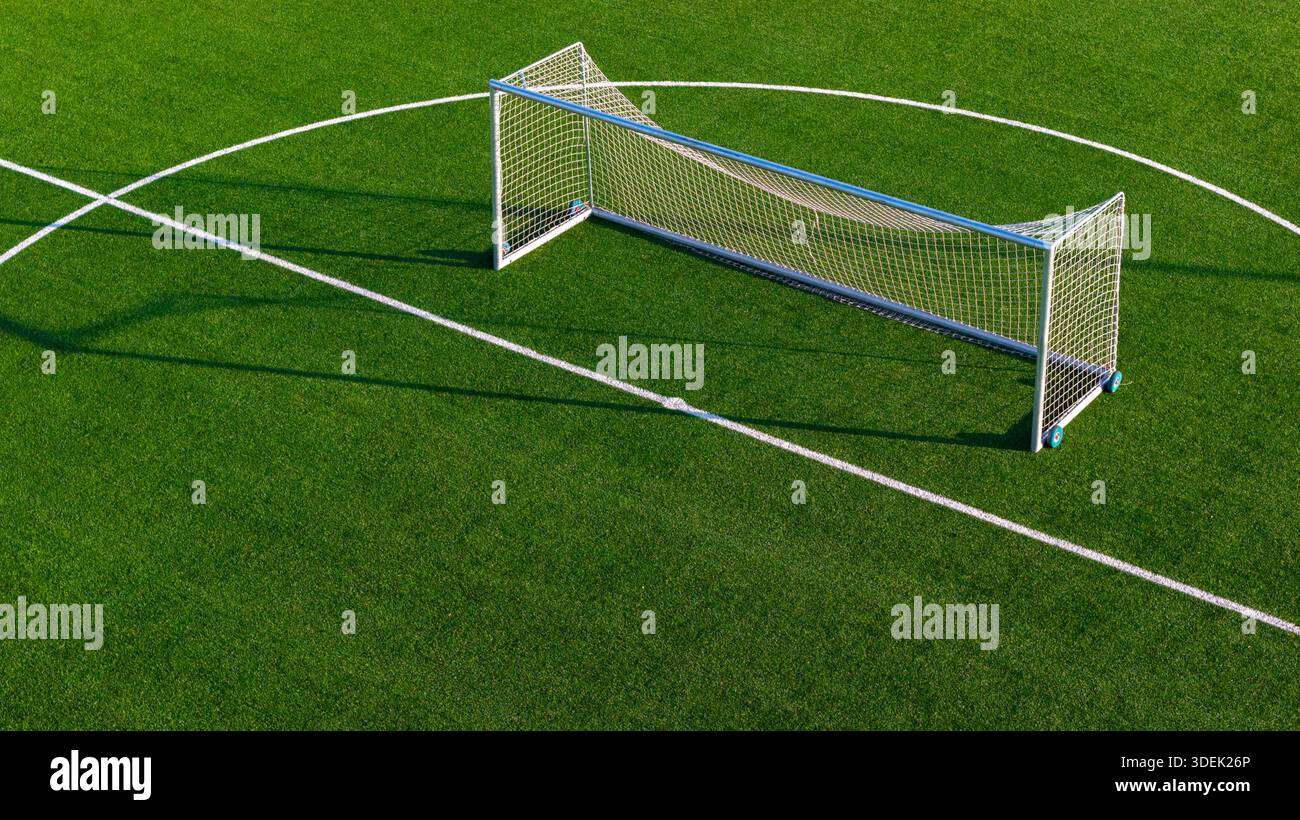 Close aerial detail of football goal structure and net on artificial ...