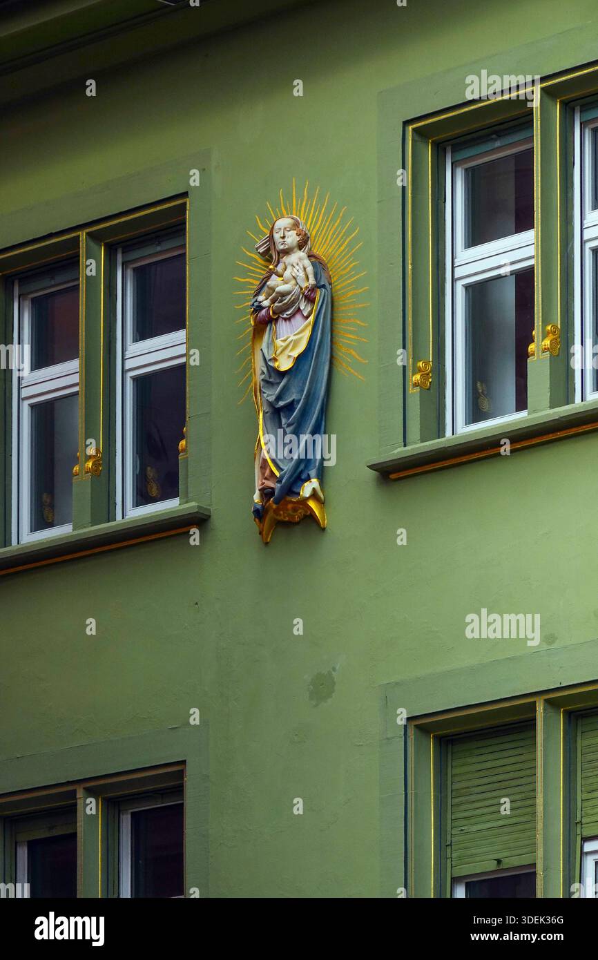 Germany, Freiburg im Breisgau, Virgin Mary and baby Jesus statue hung ...