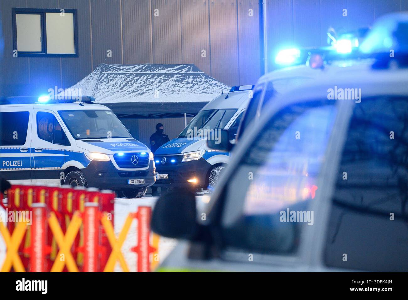 08 January 2026, Saxony-Anhalt, Magdeburg: Judicial and police vehicles ...