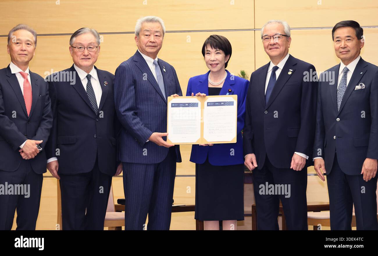 Japanese Prime Minister Sanae Takaichi (3rd from R) receives a courtesy ...