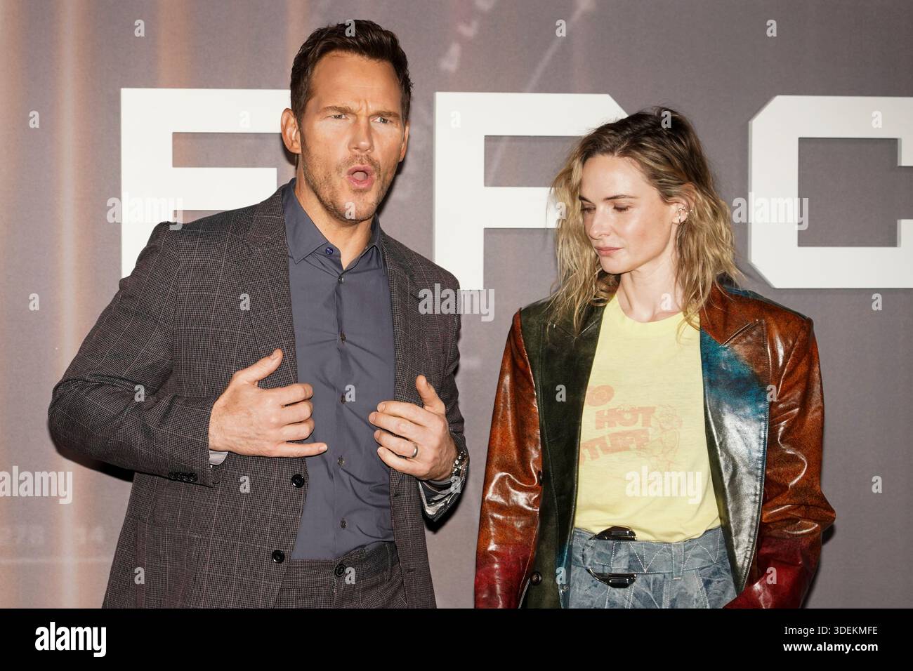 Chris Pratt, left, and Rebecca Ferguson pose for photographers upon ...