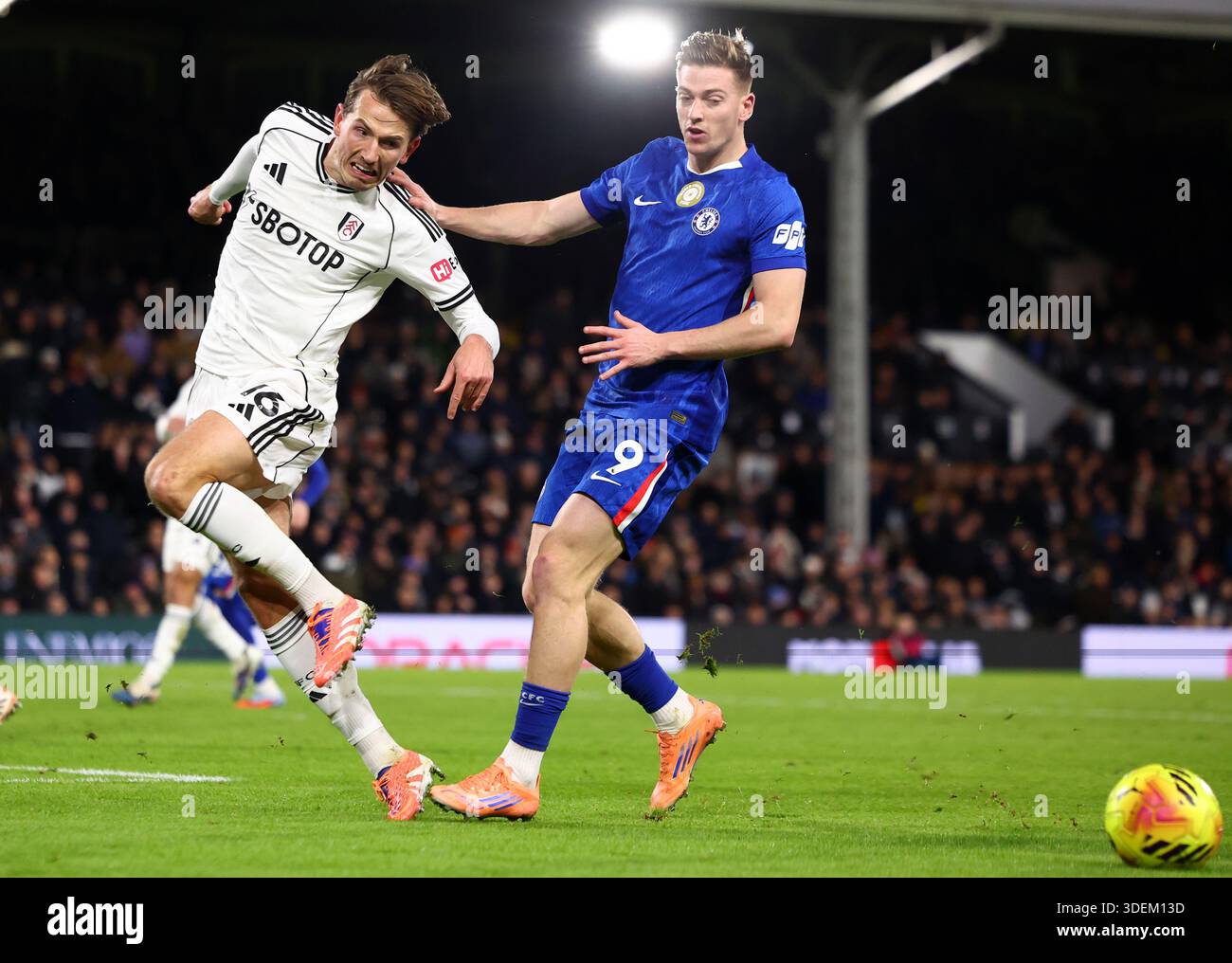 London, England, 7th January 2026. Sander Berge of Fulham and Liam Delap of Chelsea challenge ...