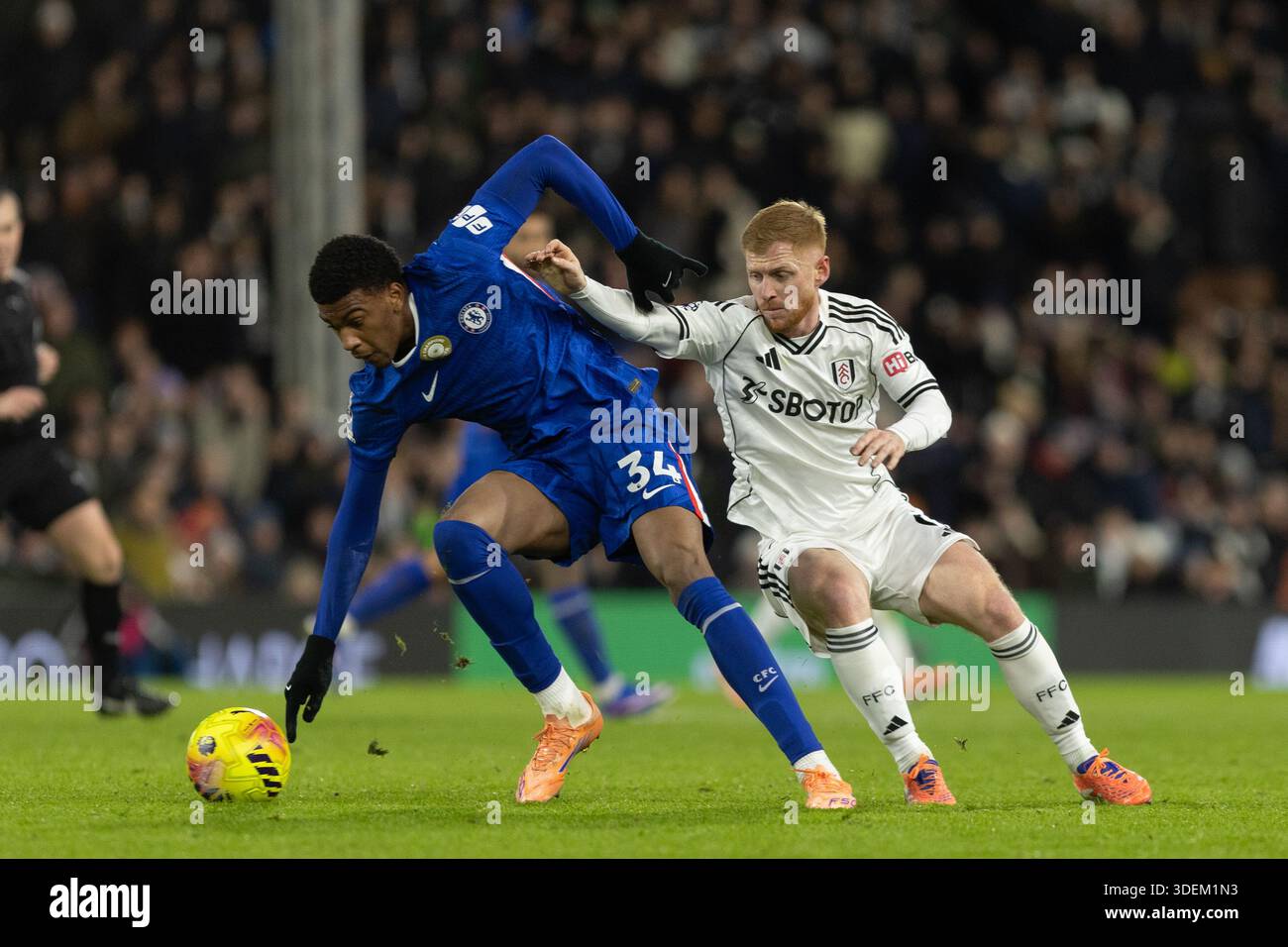 Jonathan Esenga of Fulham defends the ball from Harrison Reed of Fulham ...