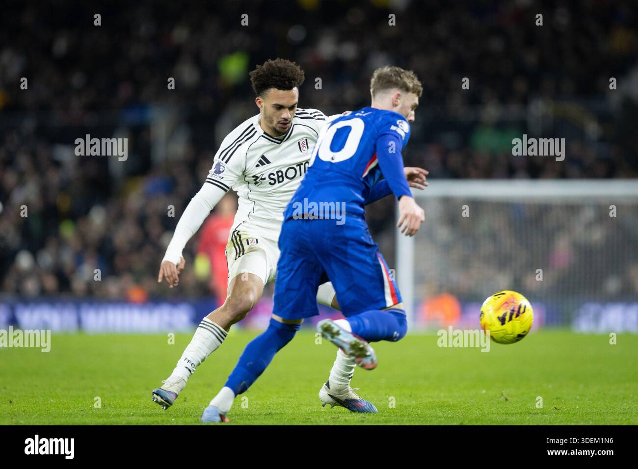 Antonee Robinson of Fulham with eyes on Cole Palmer of Chelsea during ...