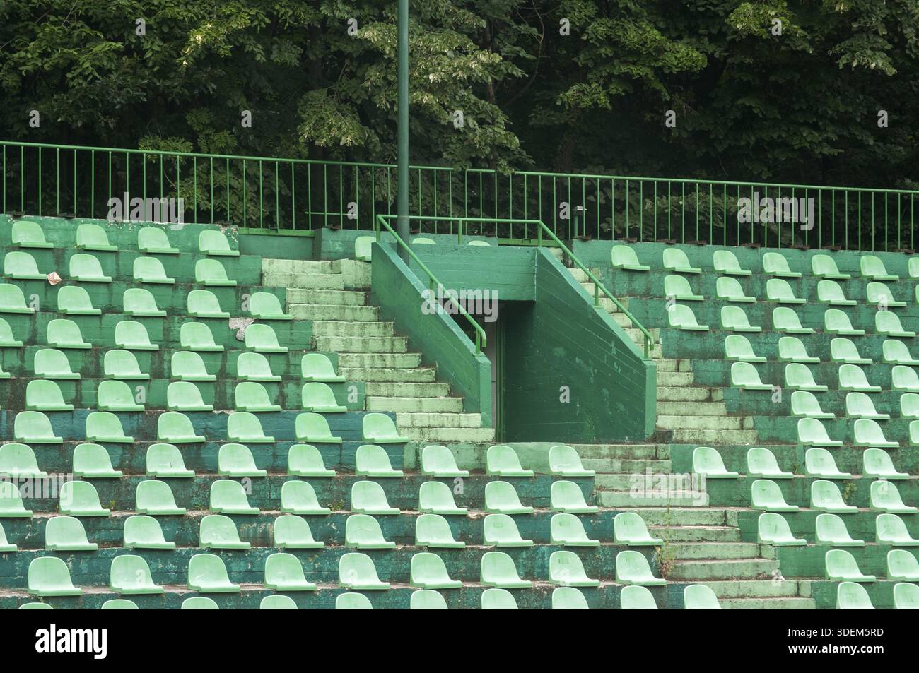 Empty green plastic spectators seats closeup on tennis court stand ...