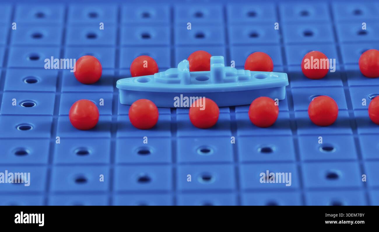 Toy destroyer surrounded by a corridor of underwater mines Stock Photo ...
