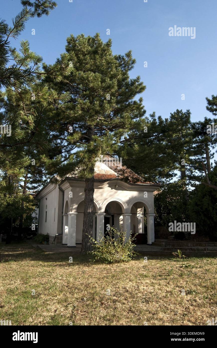 White chapel among trees in monastery courtyard Stock Photo - Alamy