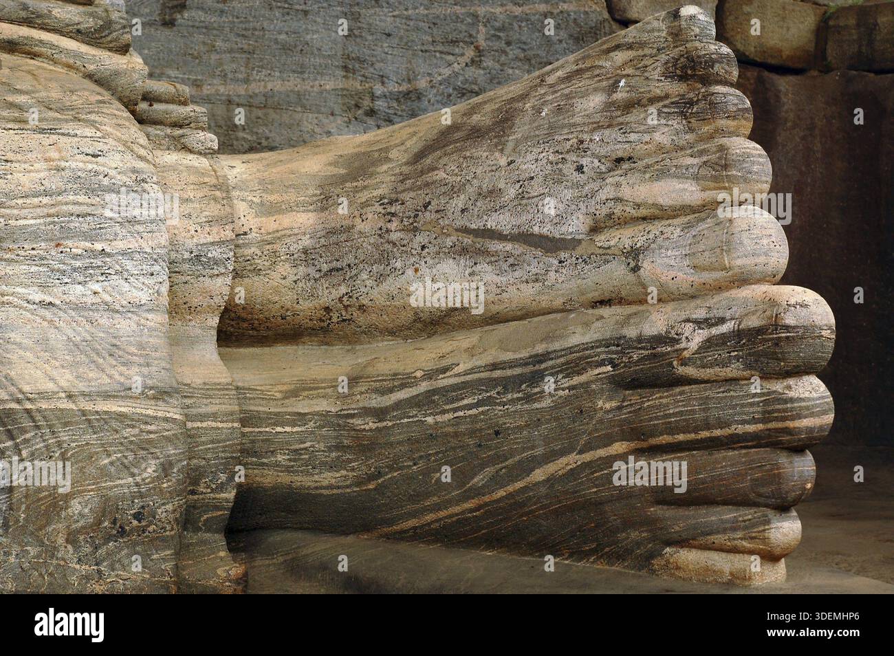The image shows the feet of reclining Buddha who has just reached ...