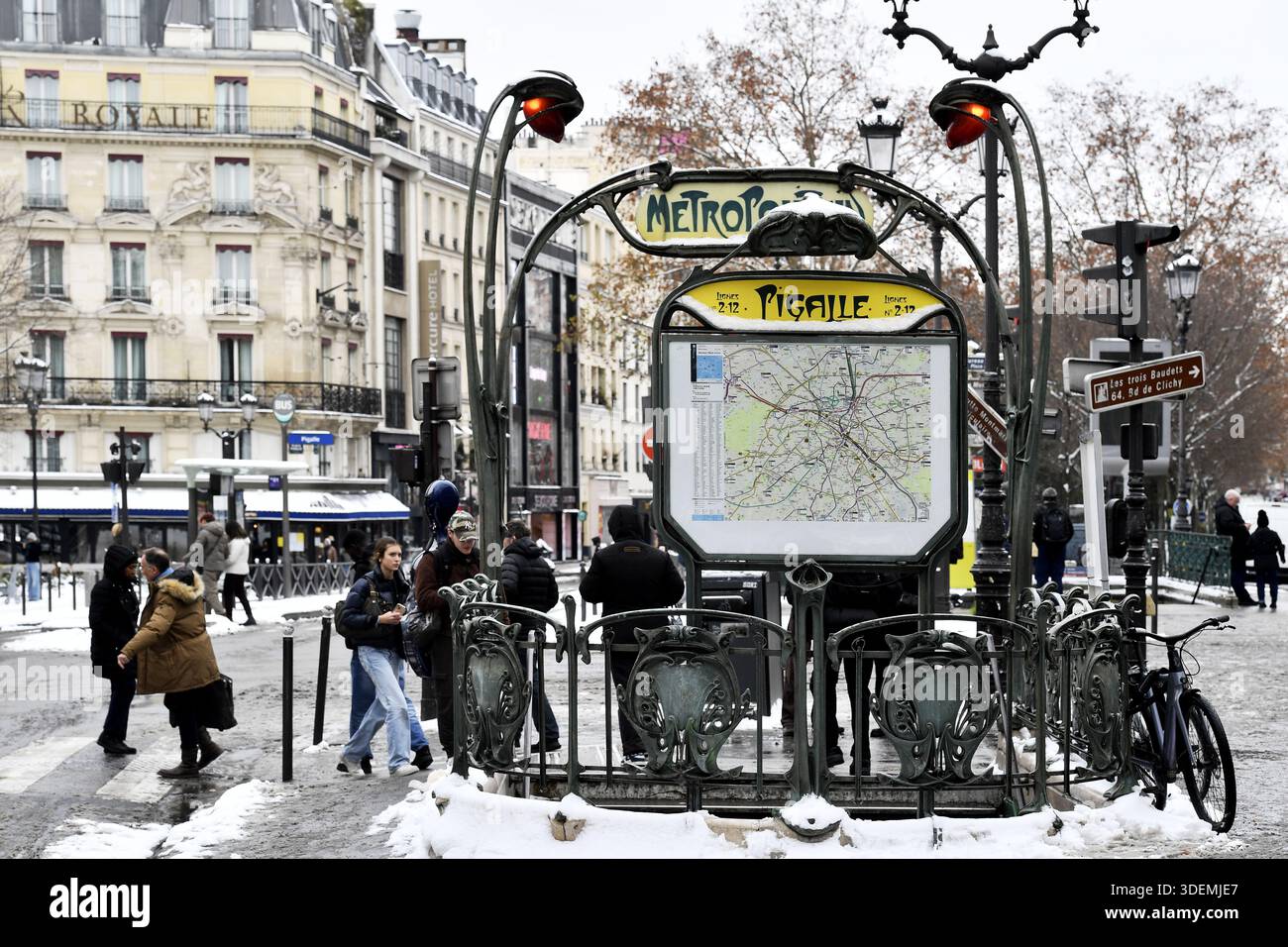Pigalle Metro station after a heavy fall of snow in winter in Paris ...