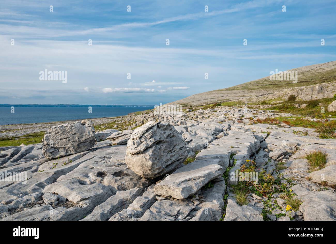 Limestone pavement with erratic boulders deposited by a glacier during ...