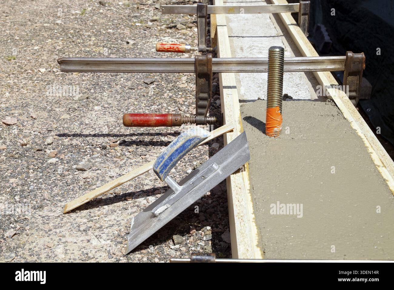 Concrete foundation and form work. Clamp tool to join planks for a form ...