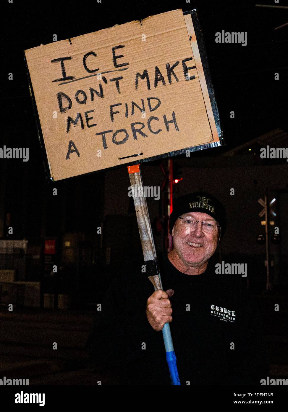 January 7, 2026, San Diego, CA: A protester holds a sign during an anti ...