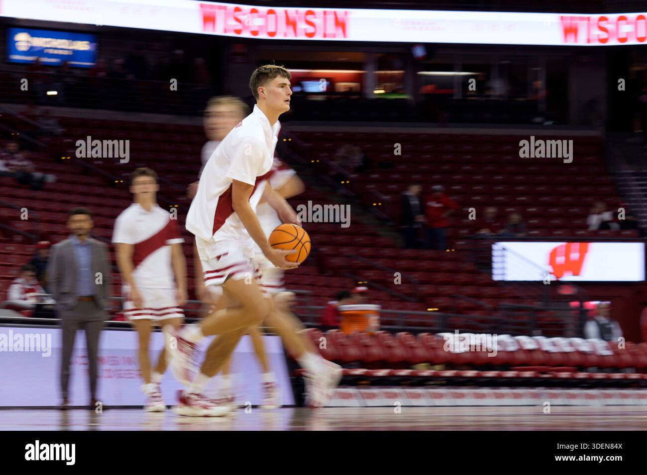 Wisconsin forward Nolan Winter passes the ball during warmups before an ...
