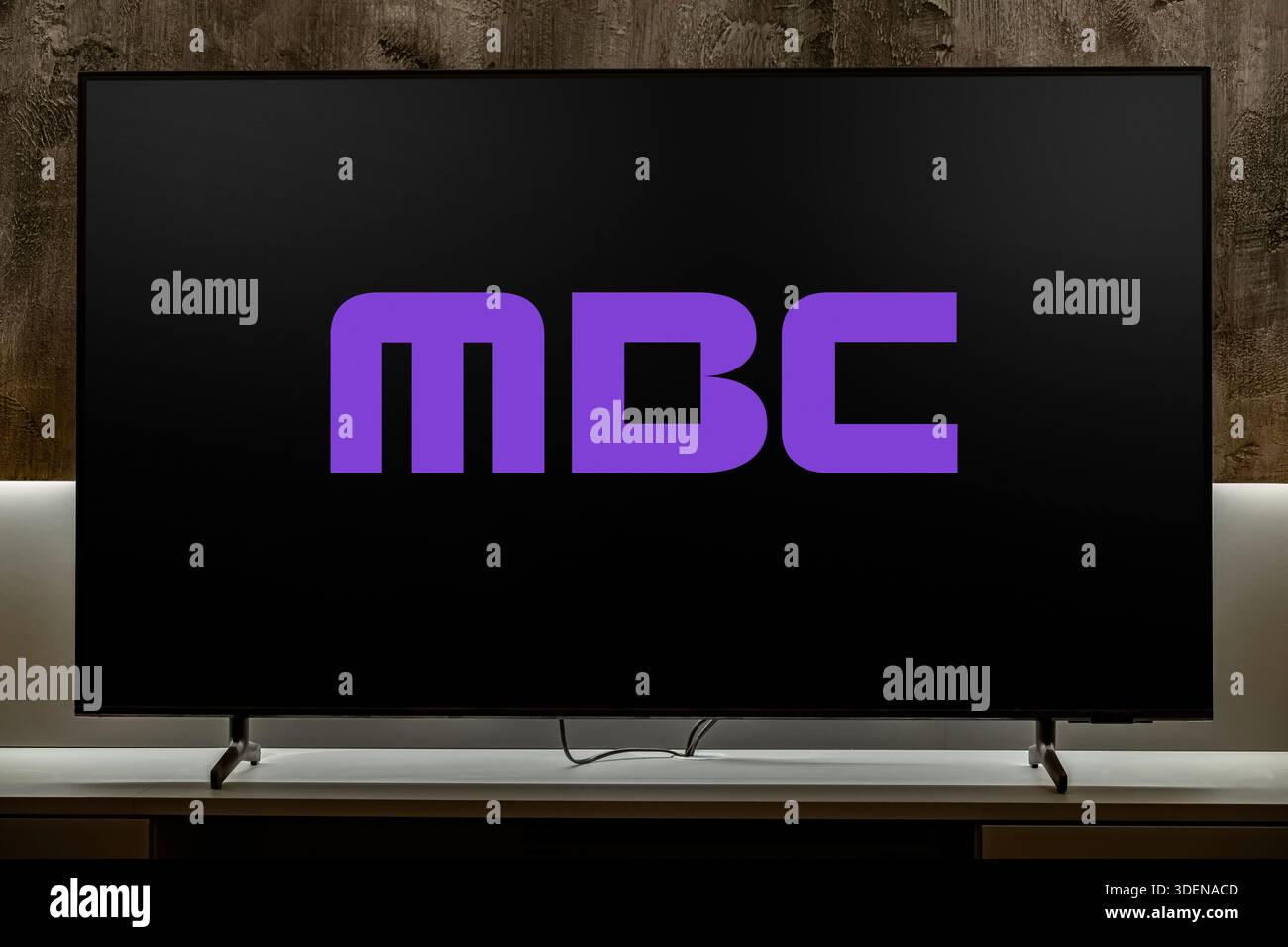 POZNAN, POL - NOV 25, 2025: Flat-screen TV set displaying logo of MBC ...