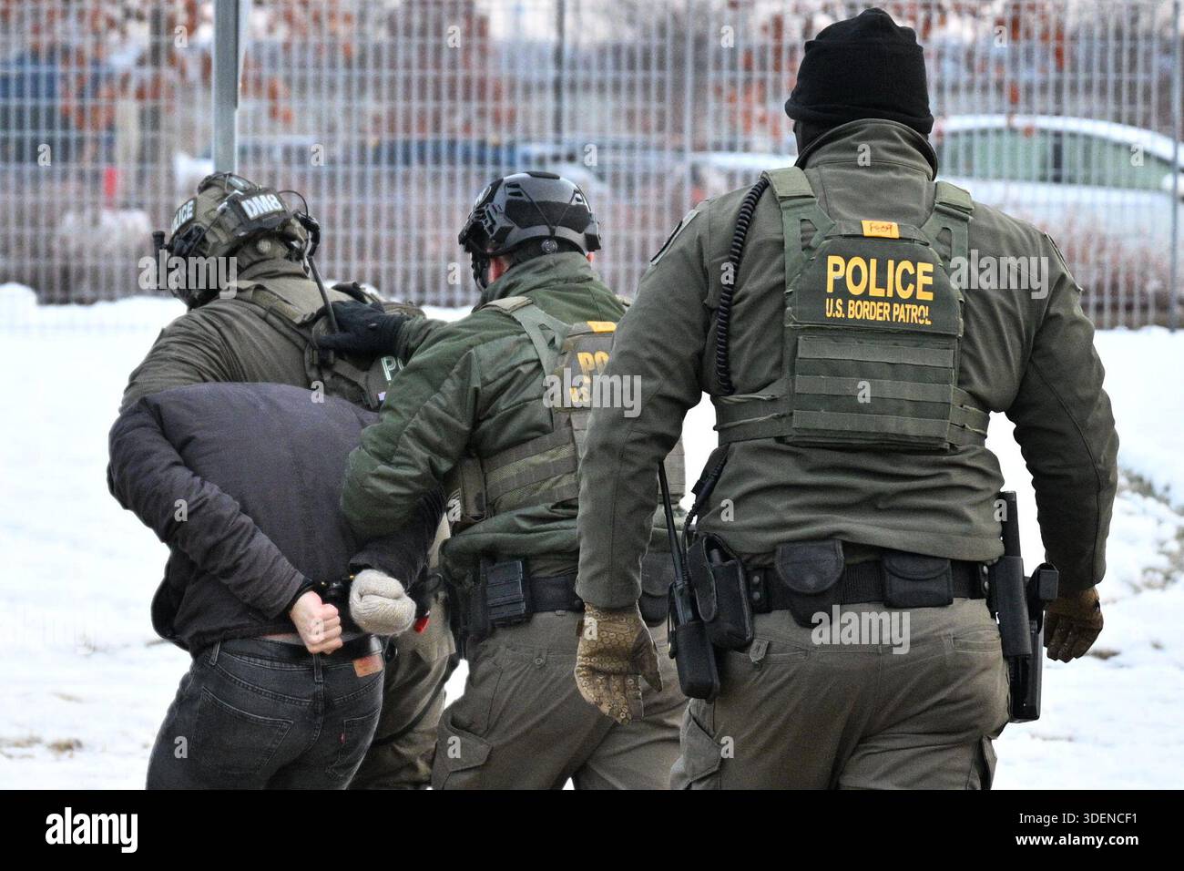 Federal agents confront protesters outside the Bishop Henry Whipple ...