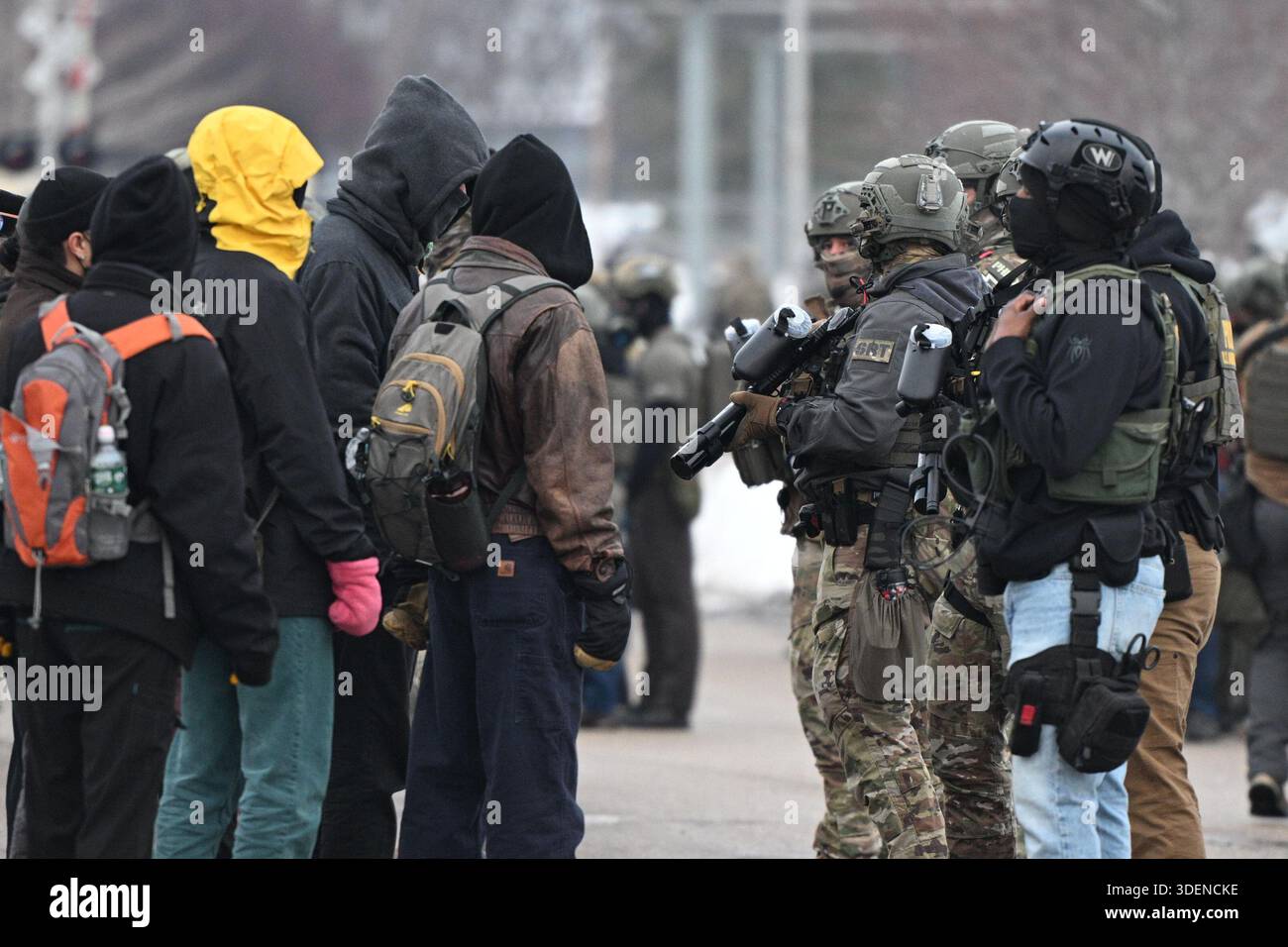 Protesters confront federal agents outside the Bishop Henry Whipple ...
