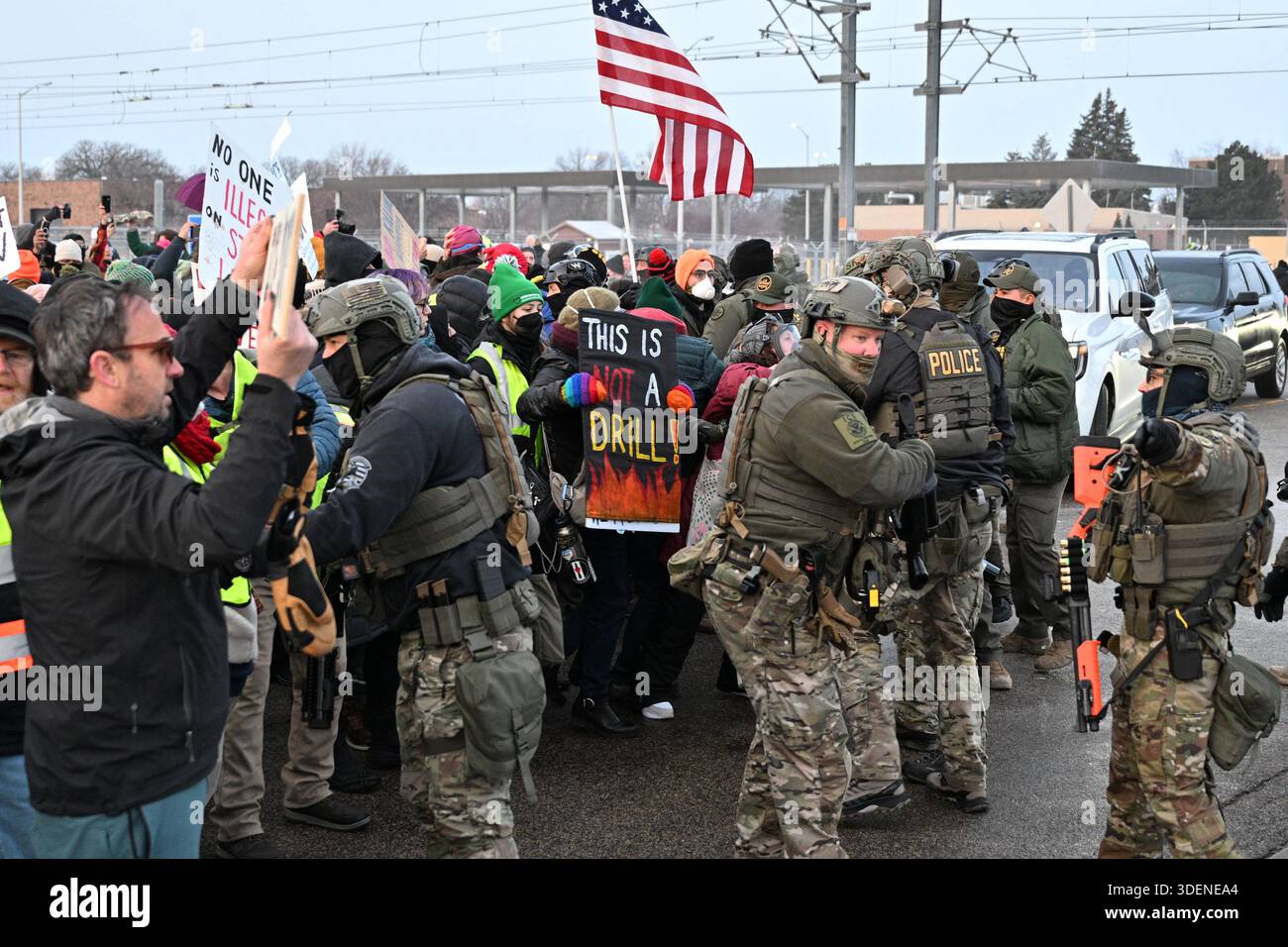 Protesters confront federal agents outside the Bishop Henry Whipple ...