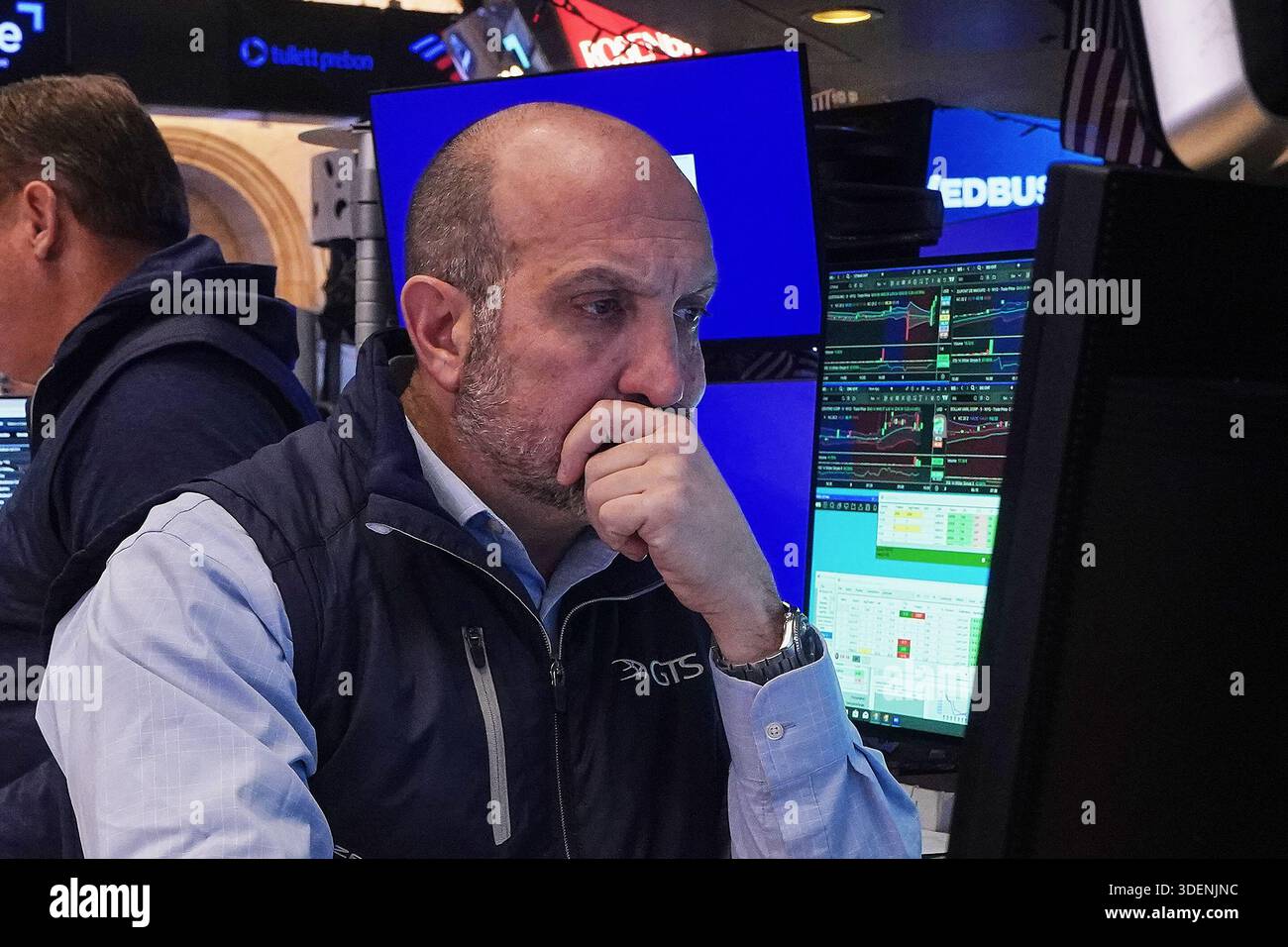 Specialist James Denaro works at his post on the floor of the New York ...