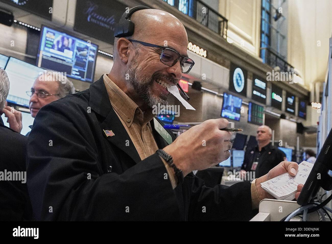 Options trader Steven Rodriguez works on the floor of the New York ...