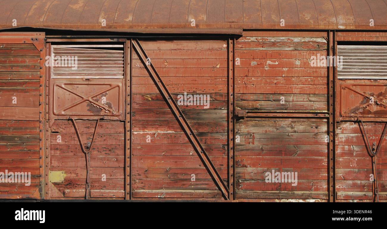 Old covered goods railway wagon wooden side as background Stock Photo ...