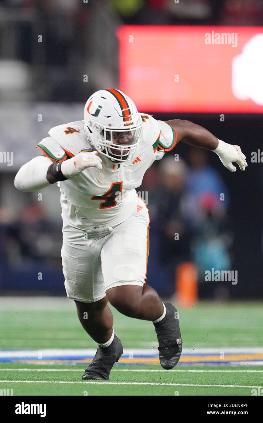 Miami defensive lineman Rueben Bain Jr. rushes in during the Cotton ...