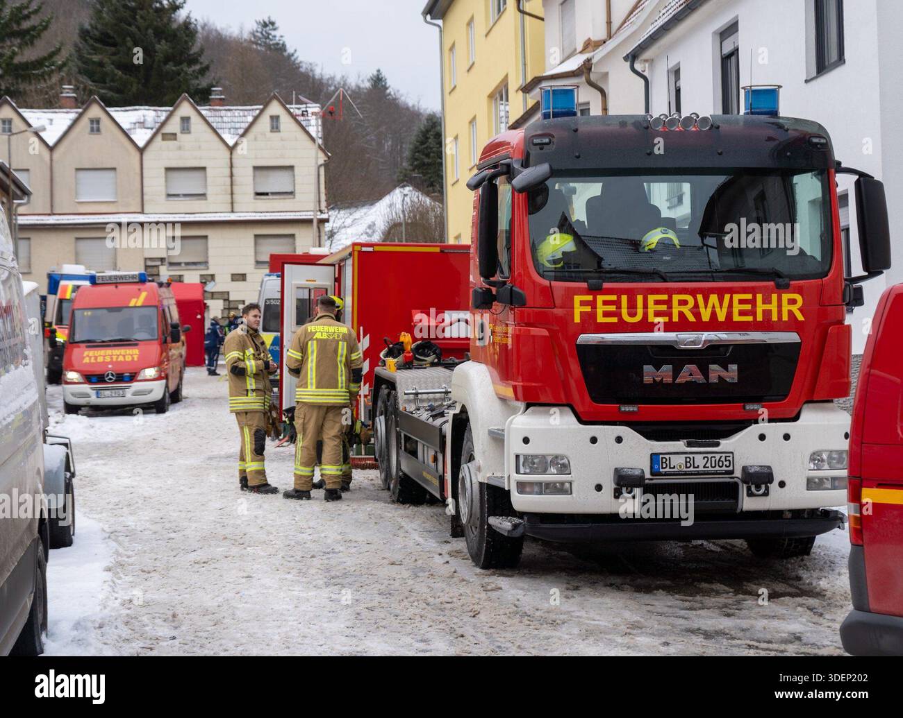 08 January 2026, Baden-Württemberg, Albstadt: Firefighters and rescue ...
