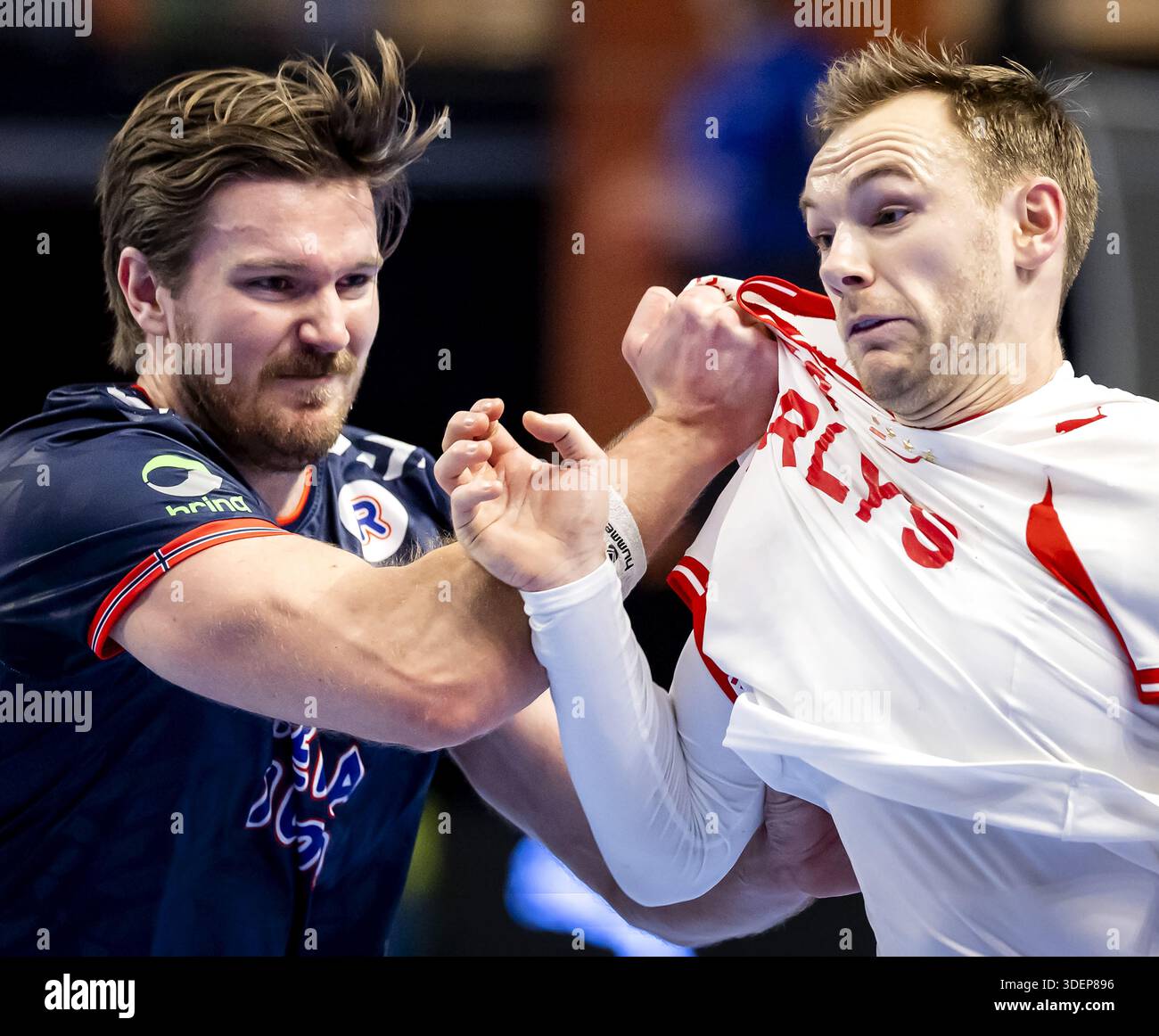 ALMERE - Mathias Gidsel of Denmark in action against Velte Rønningen of ...