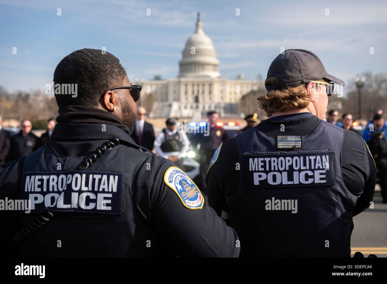Metropolitan Police Department officers stand before the body of MPD ...