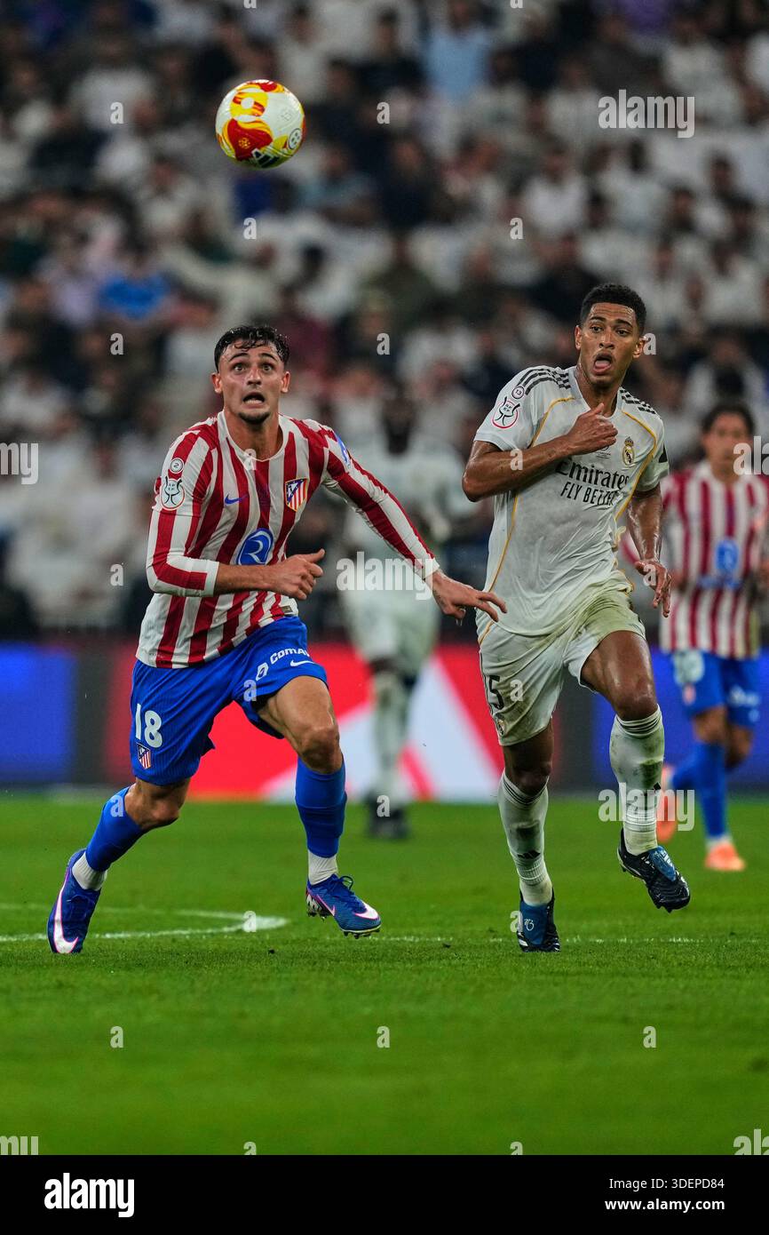 Atletico Madrid's Marc Pubill, left, and Real Madrid's Jude Bellingham ...