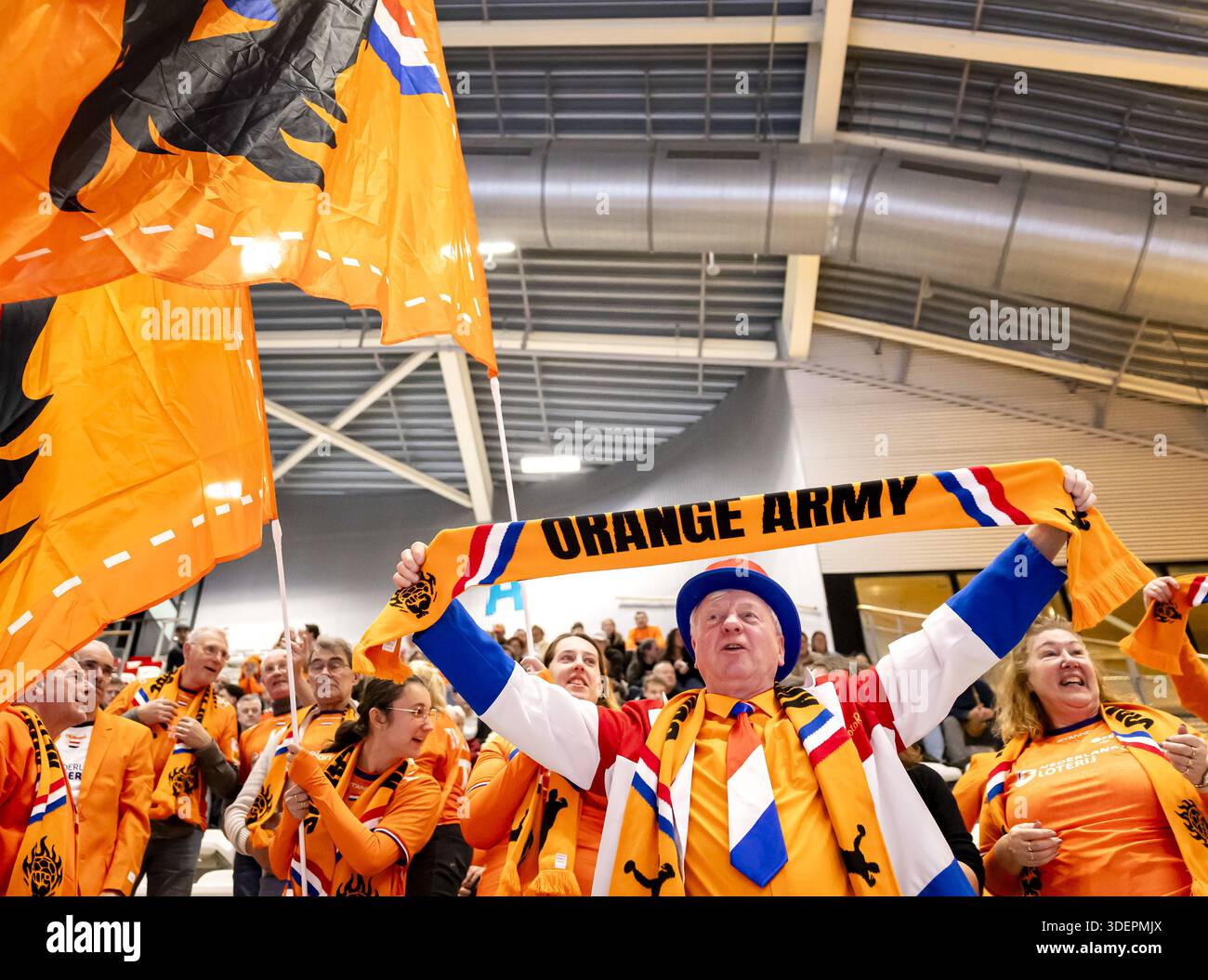 ALMERE - Spectators at the Golden League handball match between the ...