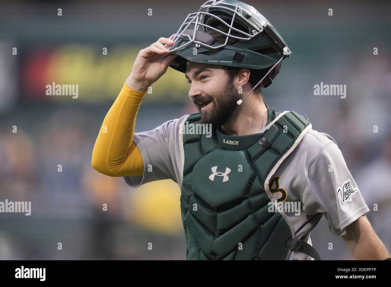 FILE - Athletics catcher Shea Langeliers takes the field for a baseball ...