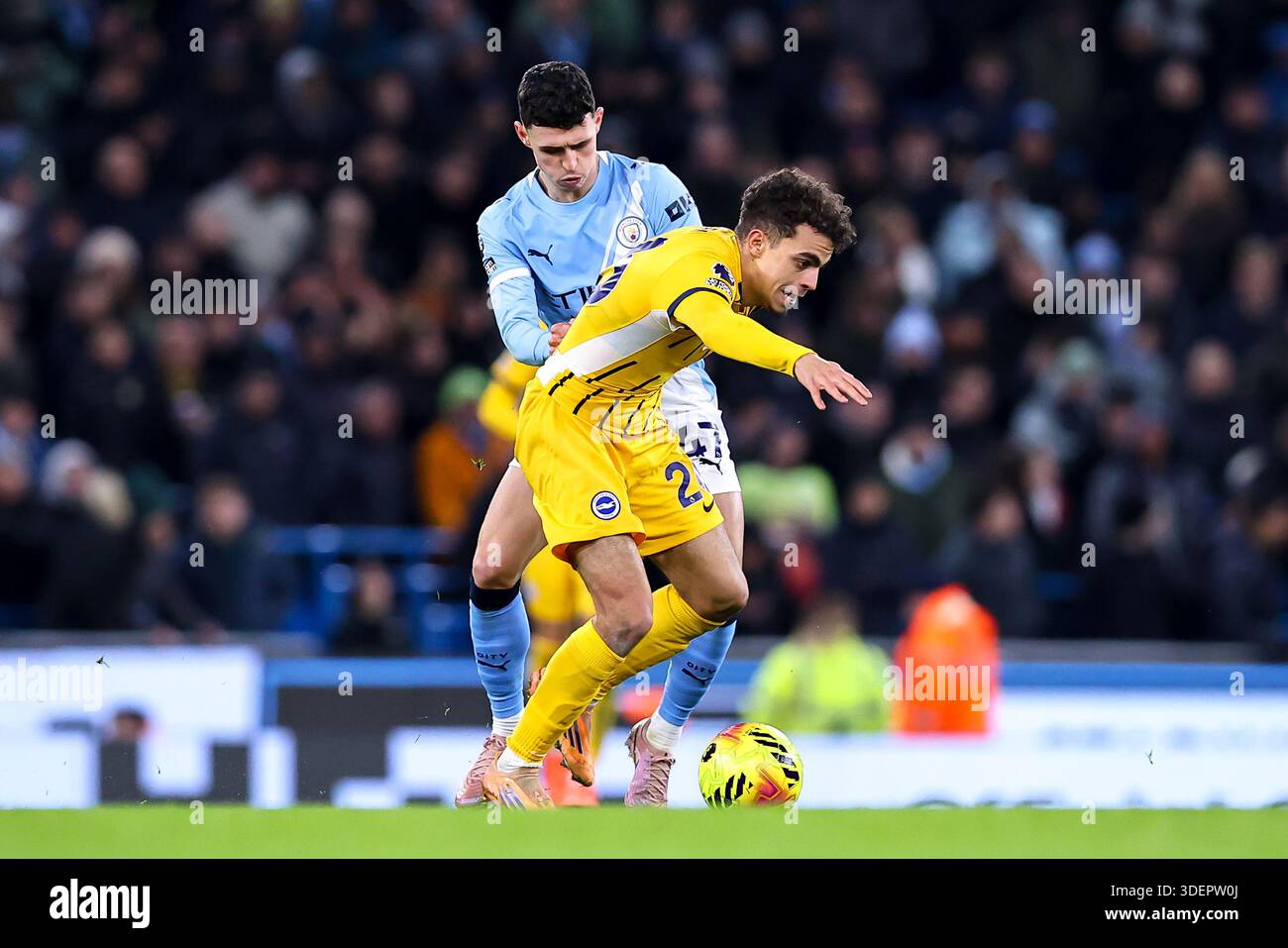 Phil Foden of Manchester City challenges Yasin Ayari of Brighton and ...