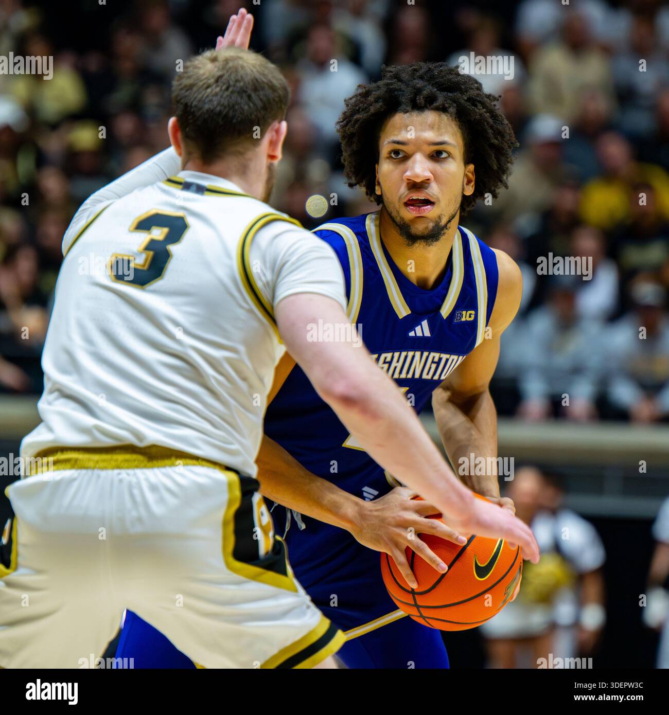 Washington guard Desmond Claude (1) is defended by Purdue guard Braden ...