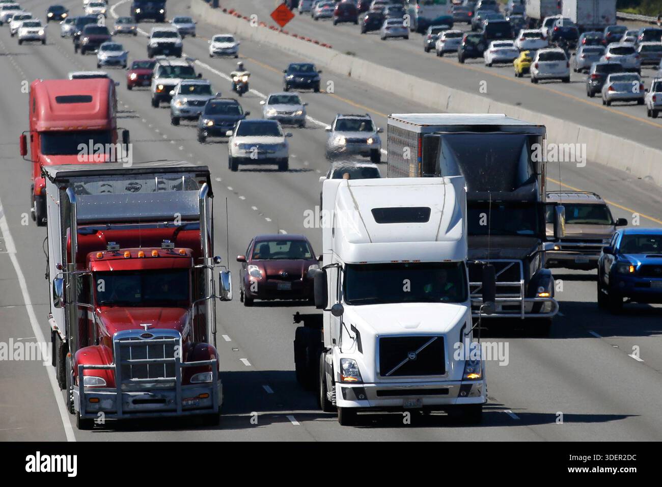FILE - Tractor trailers move along Interstate 5, headed north through ...