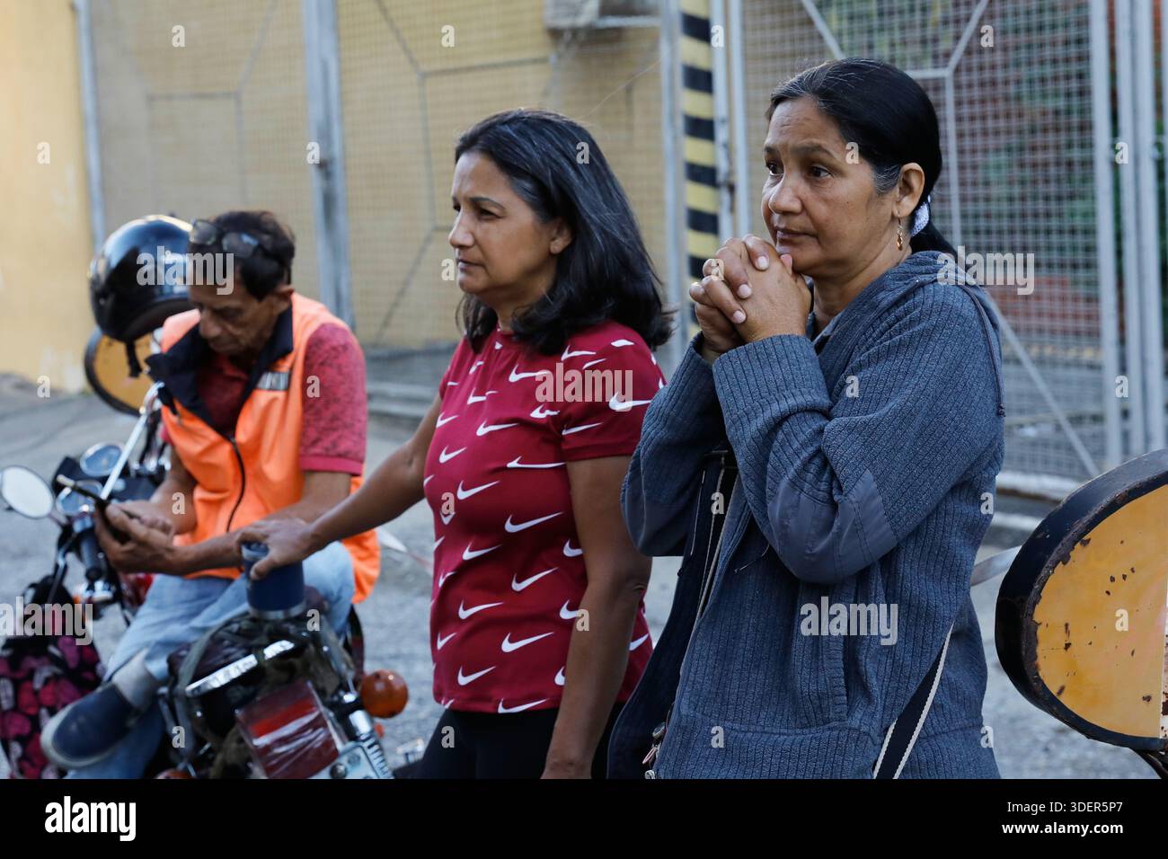 Relatives wait at Zone 7 of the Bolivarian National Police, where ...
