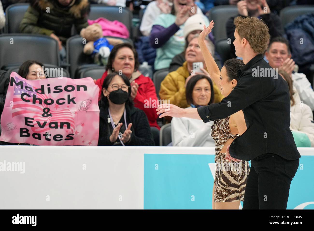 Madison Chock and Evan Bates wave to fans before competing during the ...