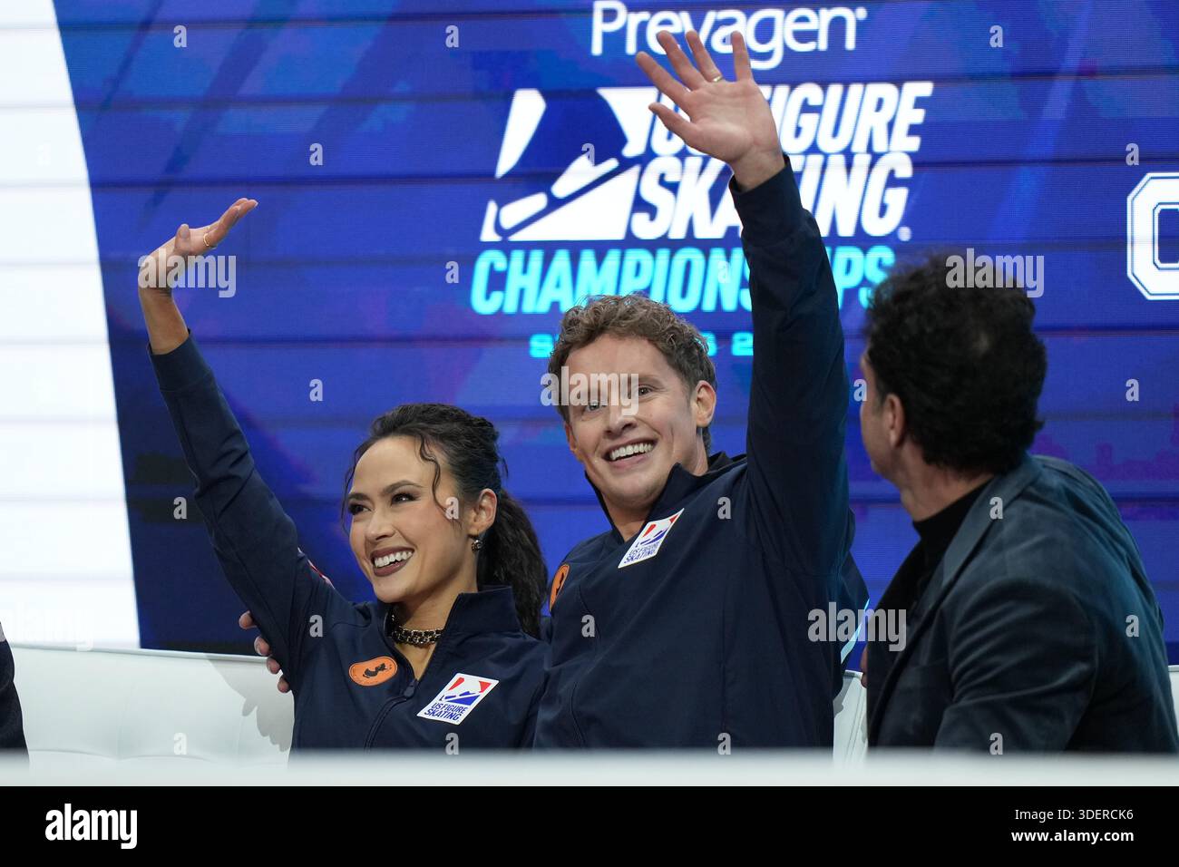 Madison Chock and Evan Bates watch the results after competing during ...