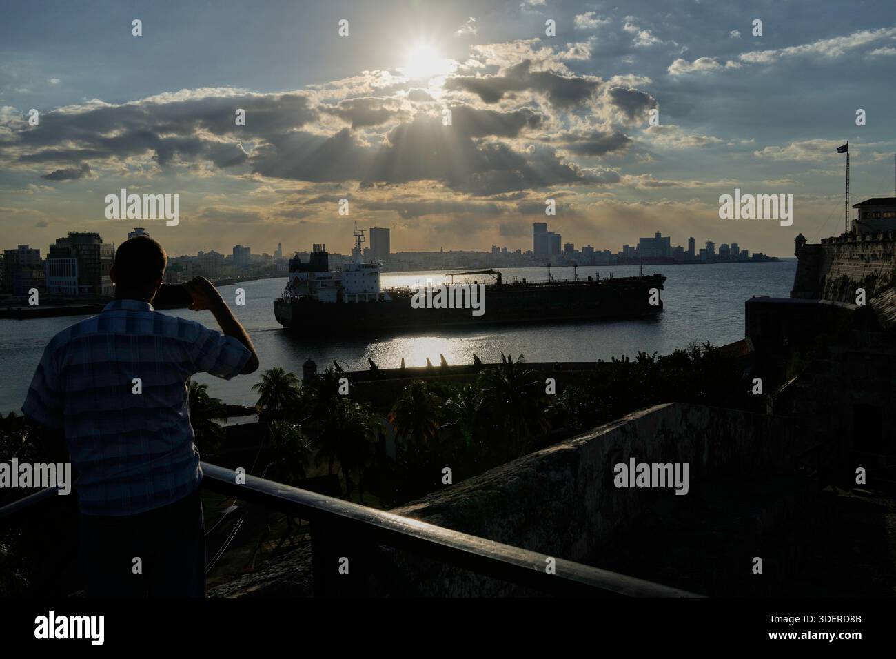 The sun sets over an oil tanker called Marlin Ammolite in Havana ...