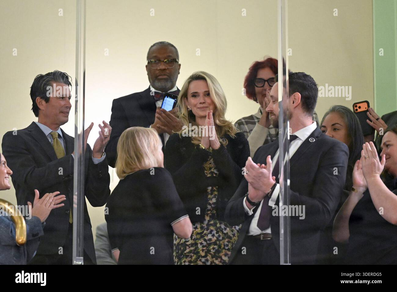 Jennifer Lynn Siebel Newsom, center, reacts as her husband, Gov. Gavin ...