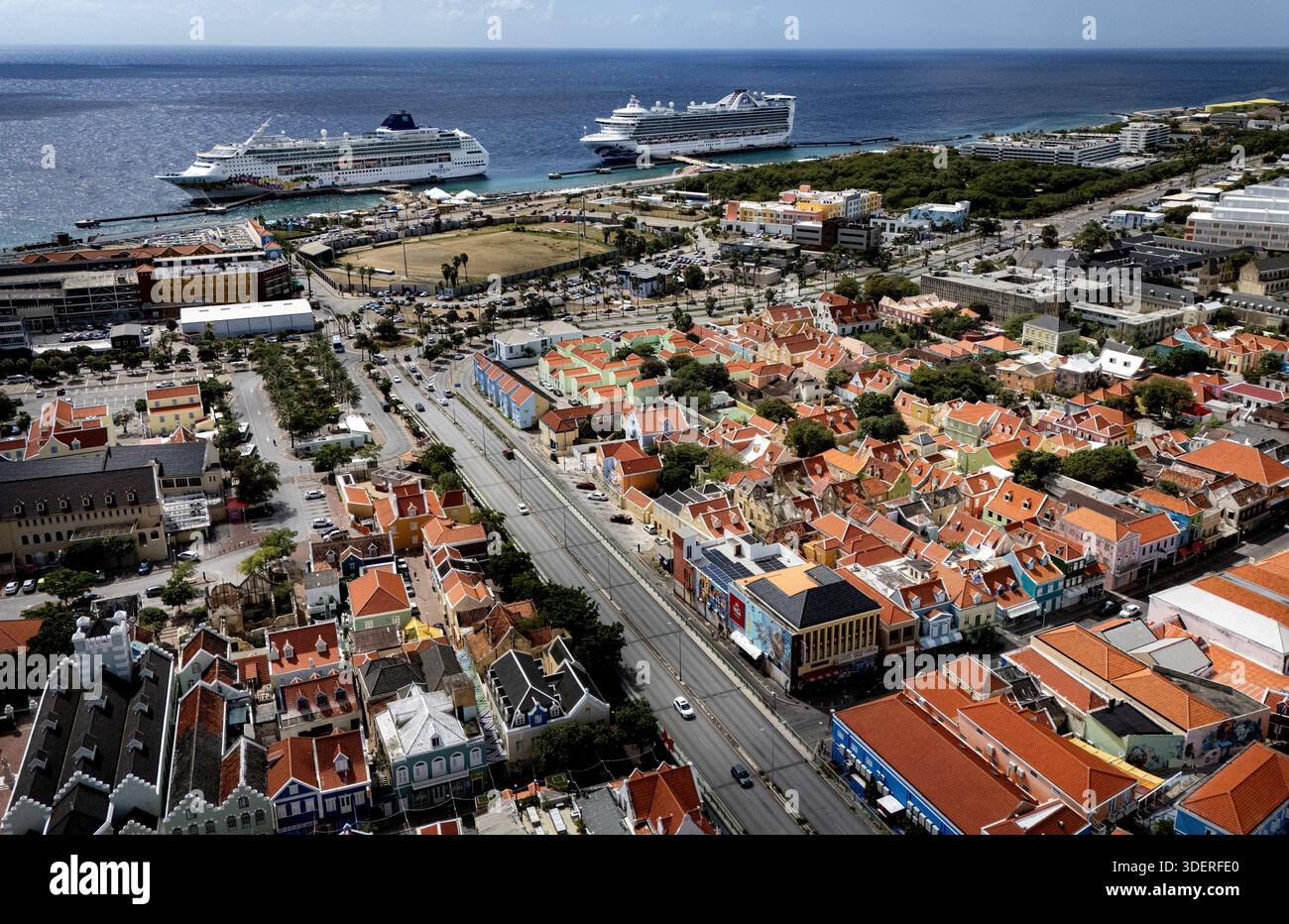 WILLEMSTAD - Two cruise ships are moored in the port of Willemstad ...