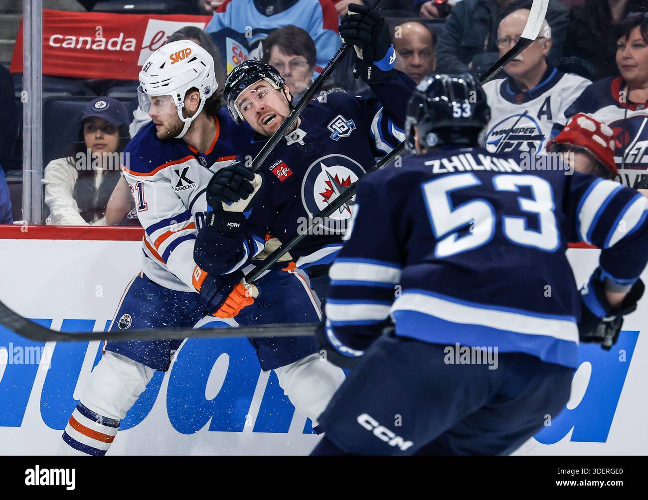 Winnipeg Jets' Tanner Pearson, second from left, and Edmonton Oilers ...